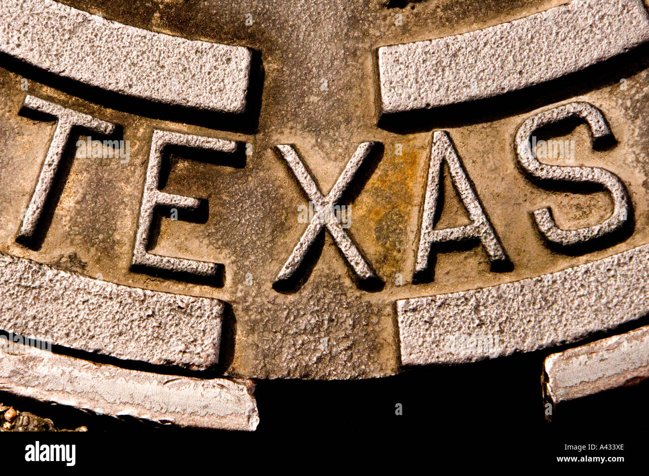 Texas text as seen on manhole cover at the University of TX Stock Photo ...
