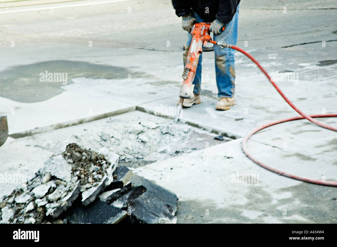 man jackhammering concrete Stock Photo - Alamy
