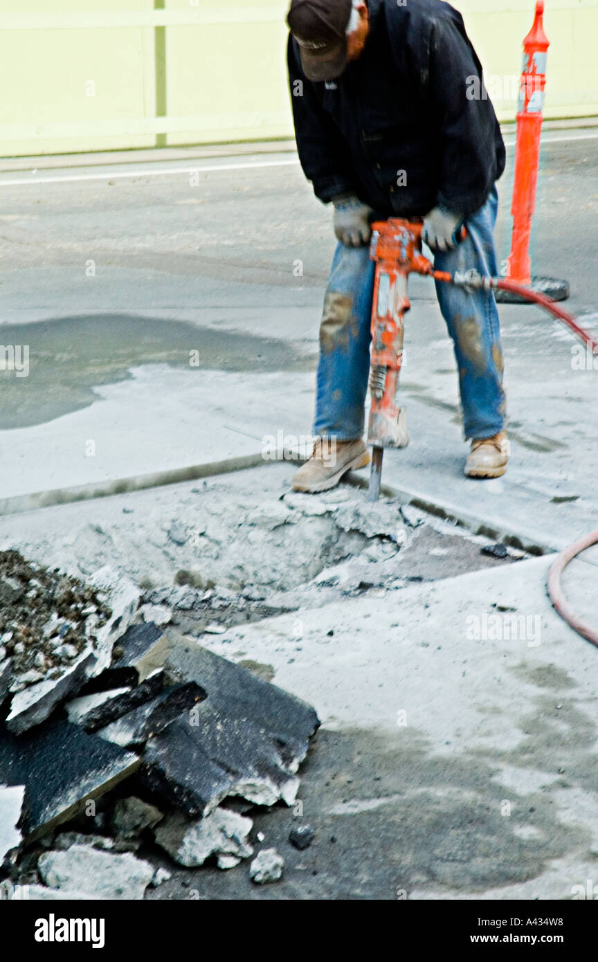 man jackhammering concrete Stock Photo - Alamy