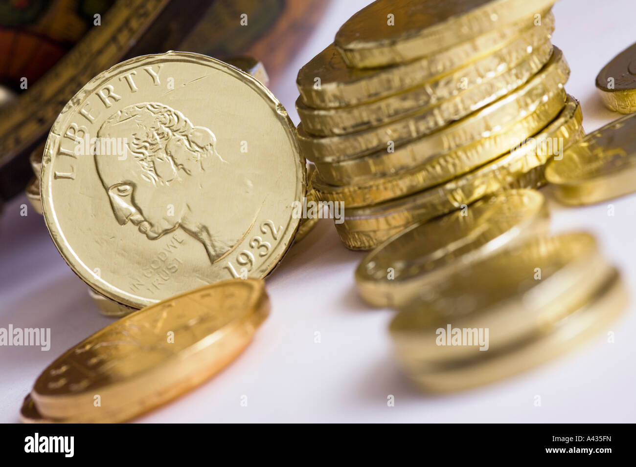 Golden chocolate coins Stock Photo - Alamy