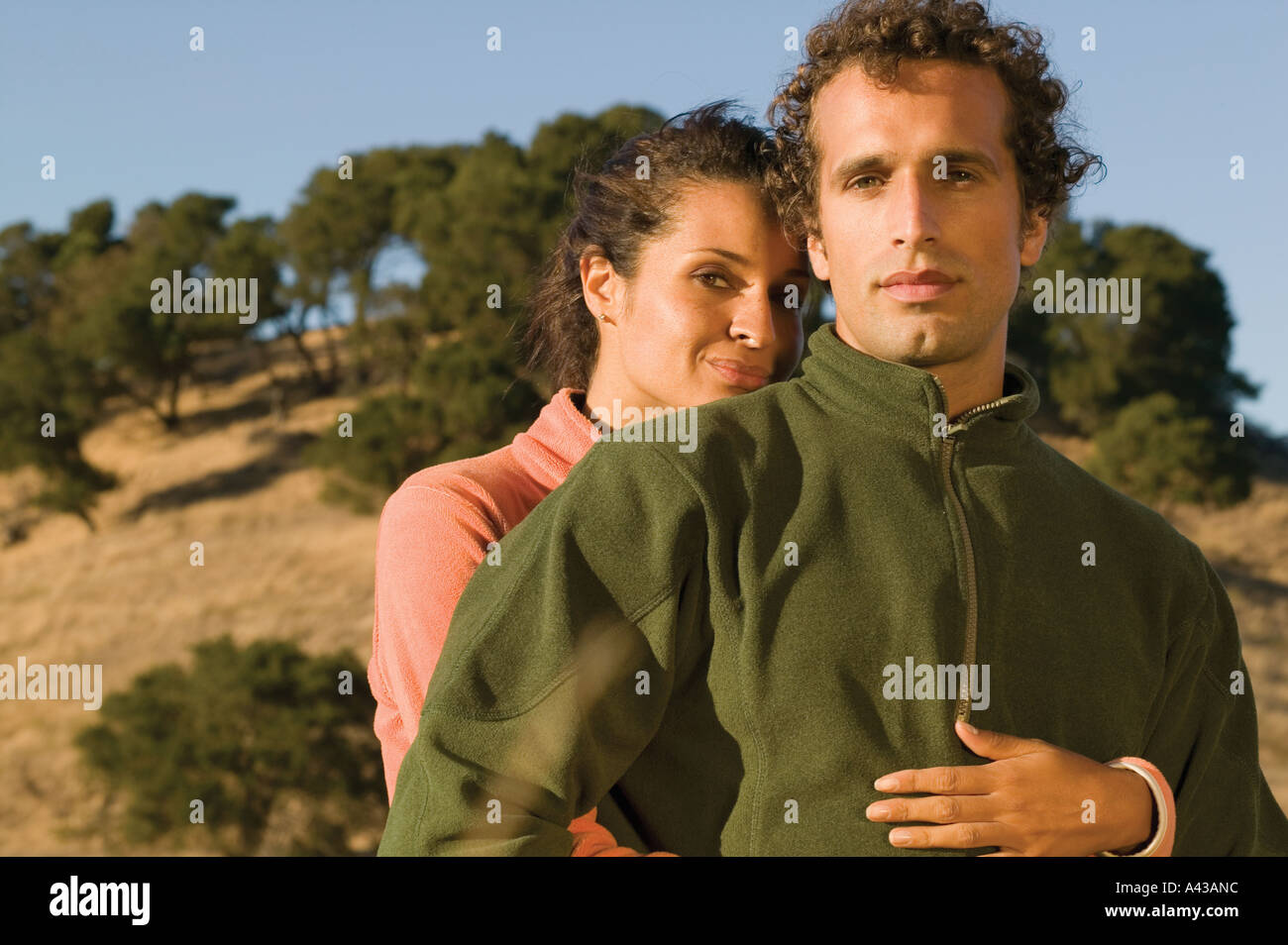 Portrait of couple hugging Stock Photo - Alamy