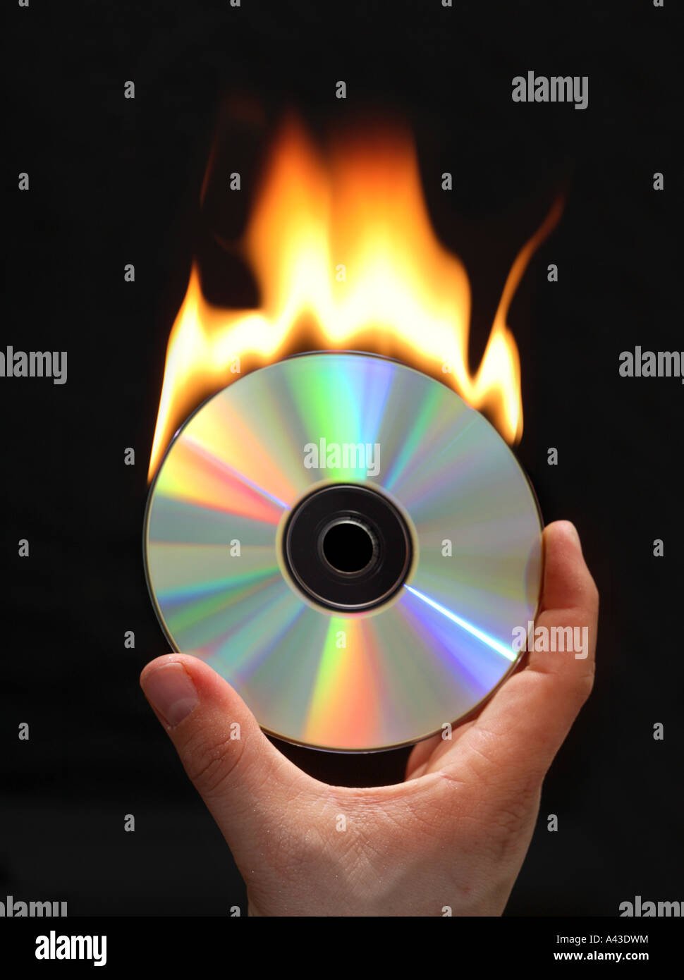 Hand holding burning disk Stock Photo - Alamy