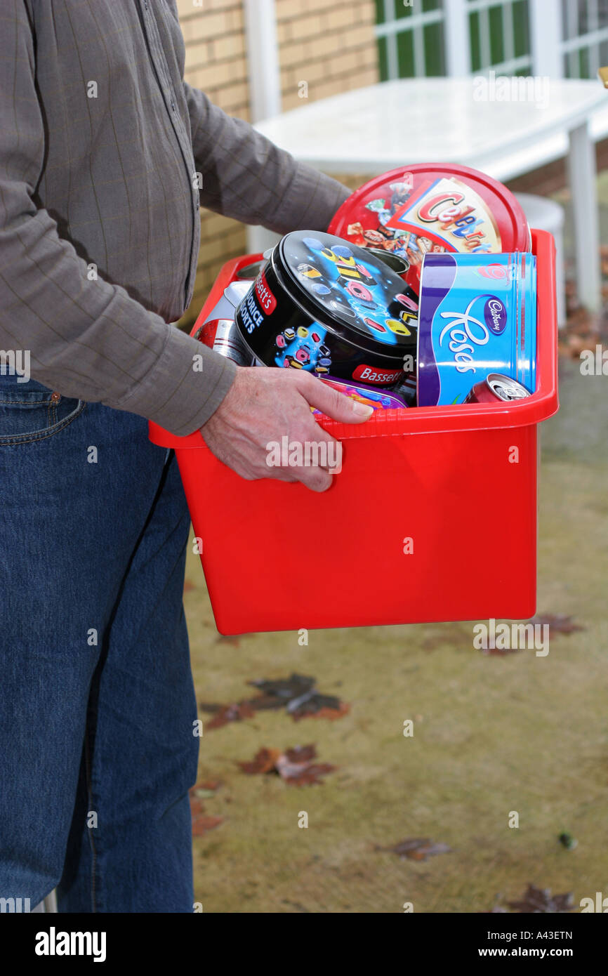 Assorted recyclable metal steel can tin packaging waste products in red ...