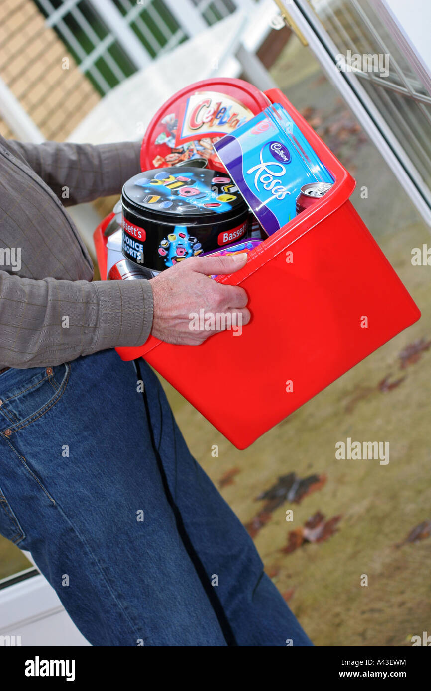 Assorted recyclable metal steel can tin packaging waste products in red ...