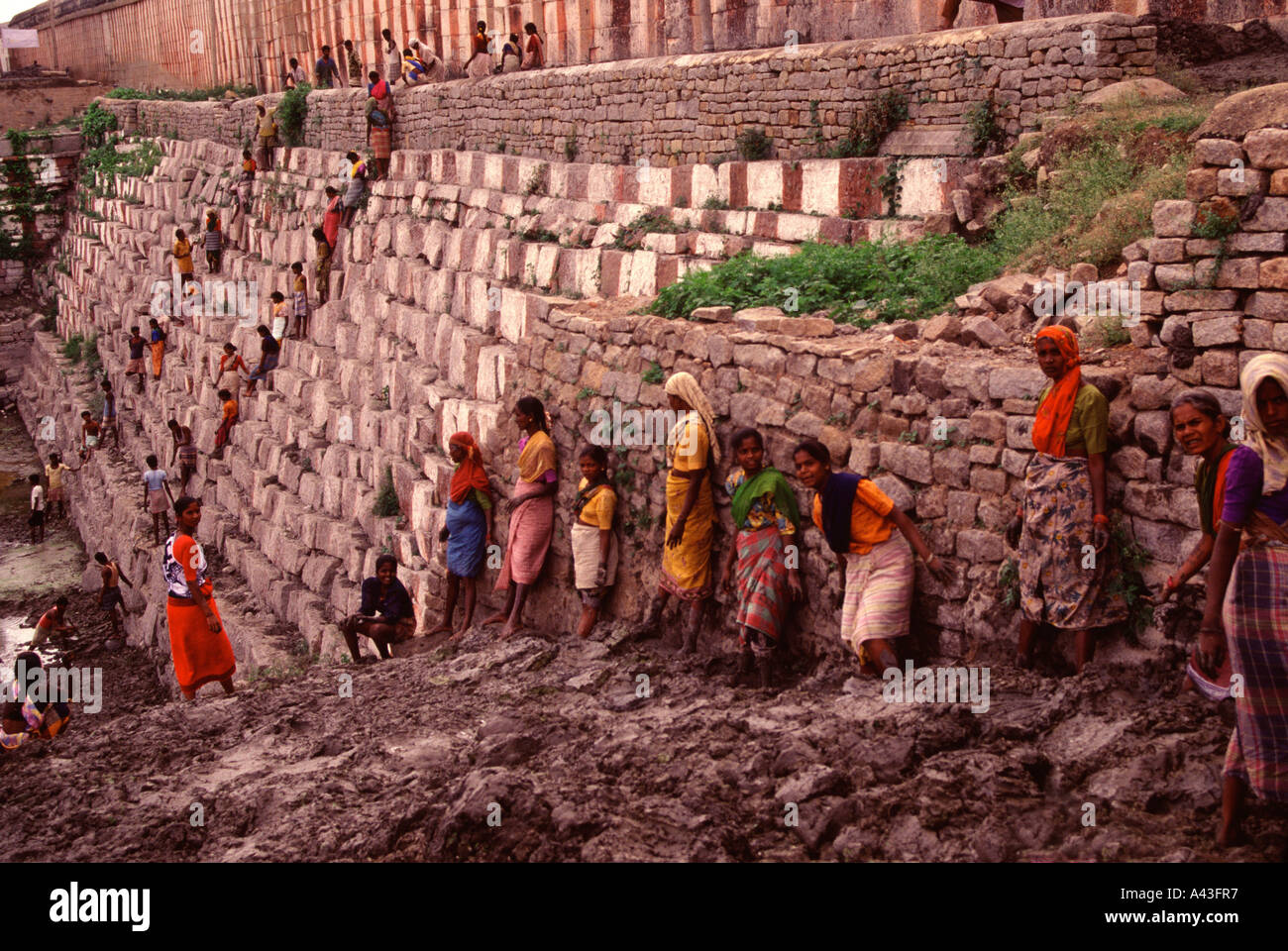 Women working at the Manmatha water tank adjacent to Virupaksha temple ...