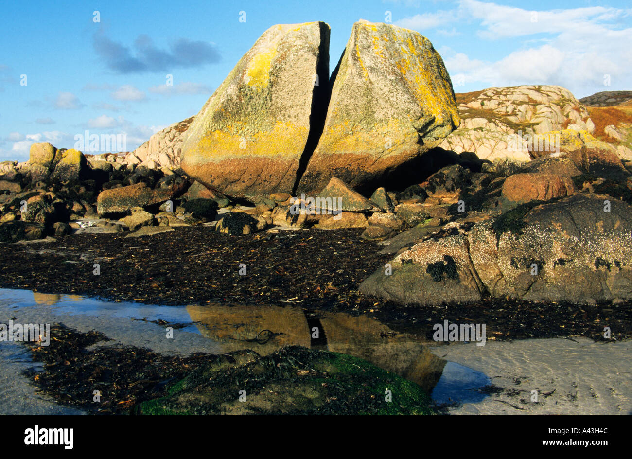 Split rock on beach Stock Photo - Alamy