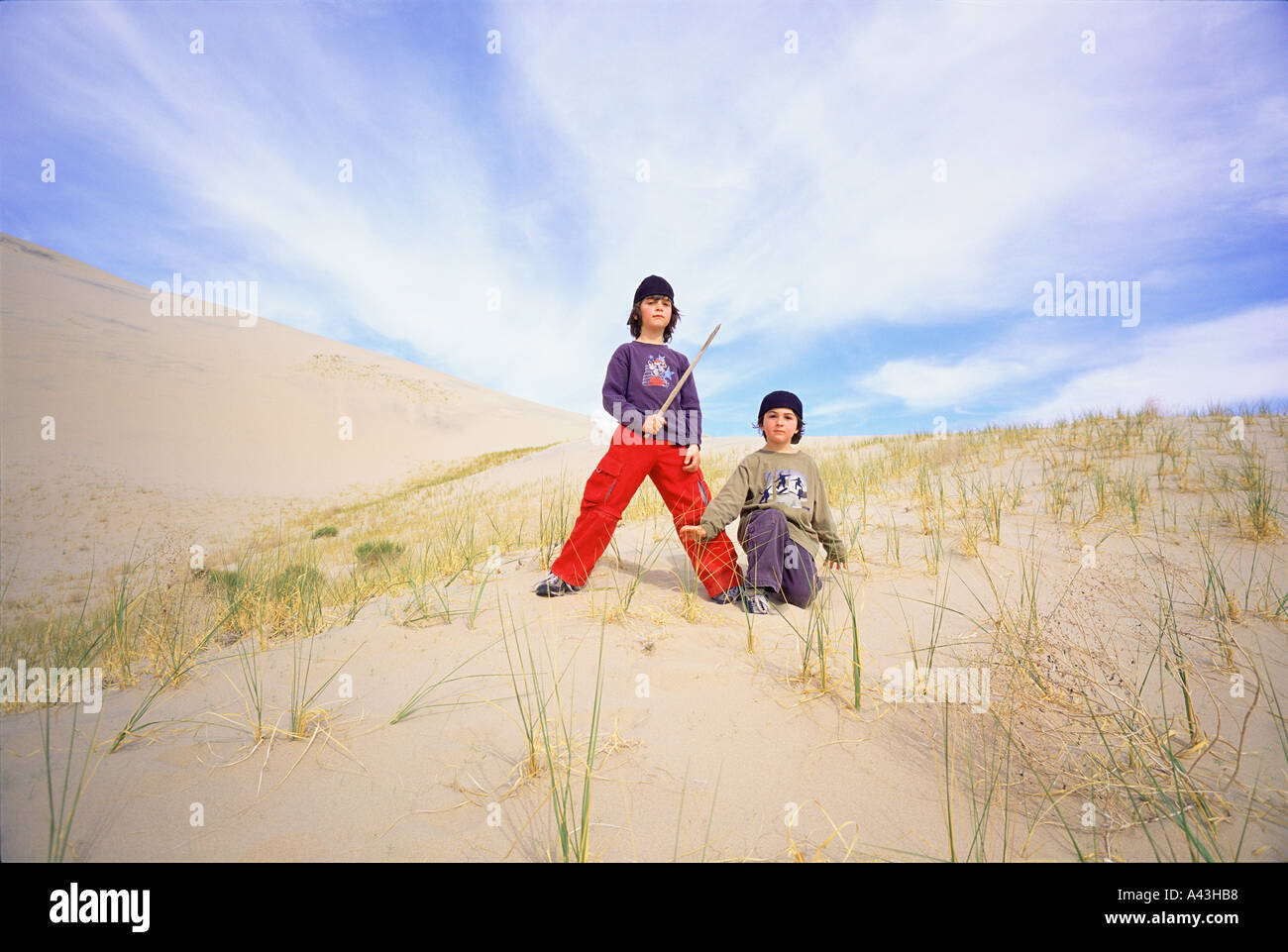 Brothers on sand dune Stock Photo - Alamy