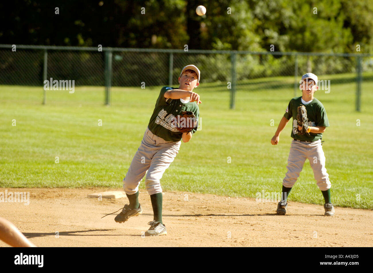 Brown boy playing baseball hi-res stock photography and images - Alamy