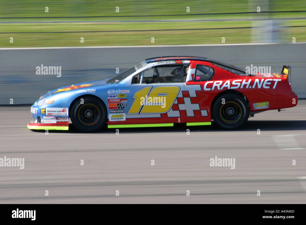 V8 Nascar type stock cars racing on a banked oval circuit Stock Photo ...