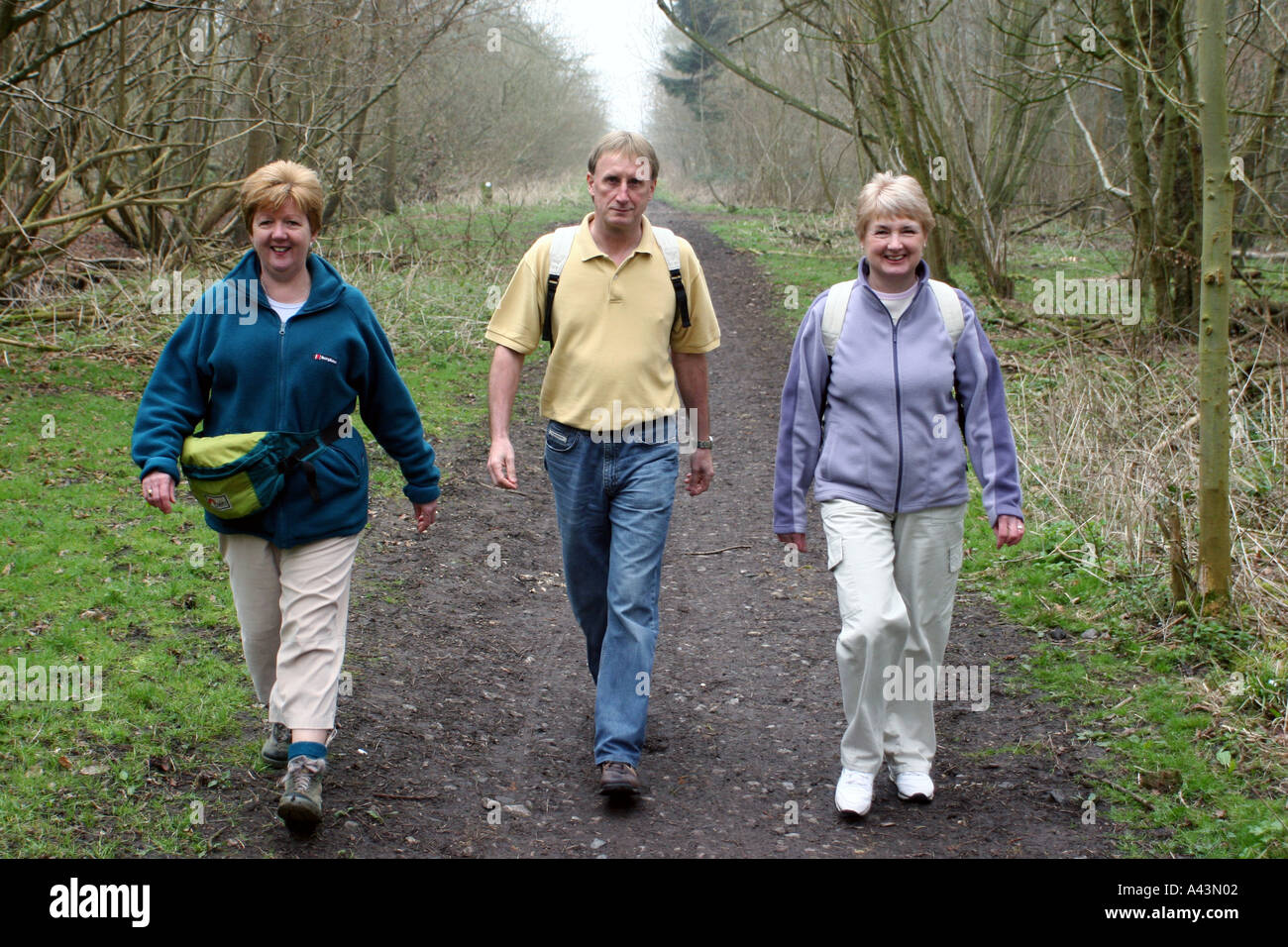 Three Friends Out For A Walk Stock Photo - Alamy