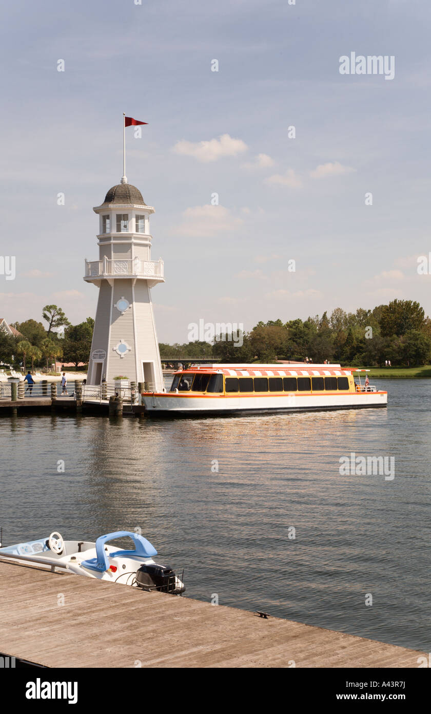 Shuttle boat loads passengers at lighthouse dock at Boardwalk in Walt ...