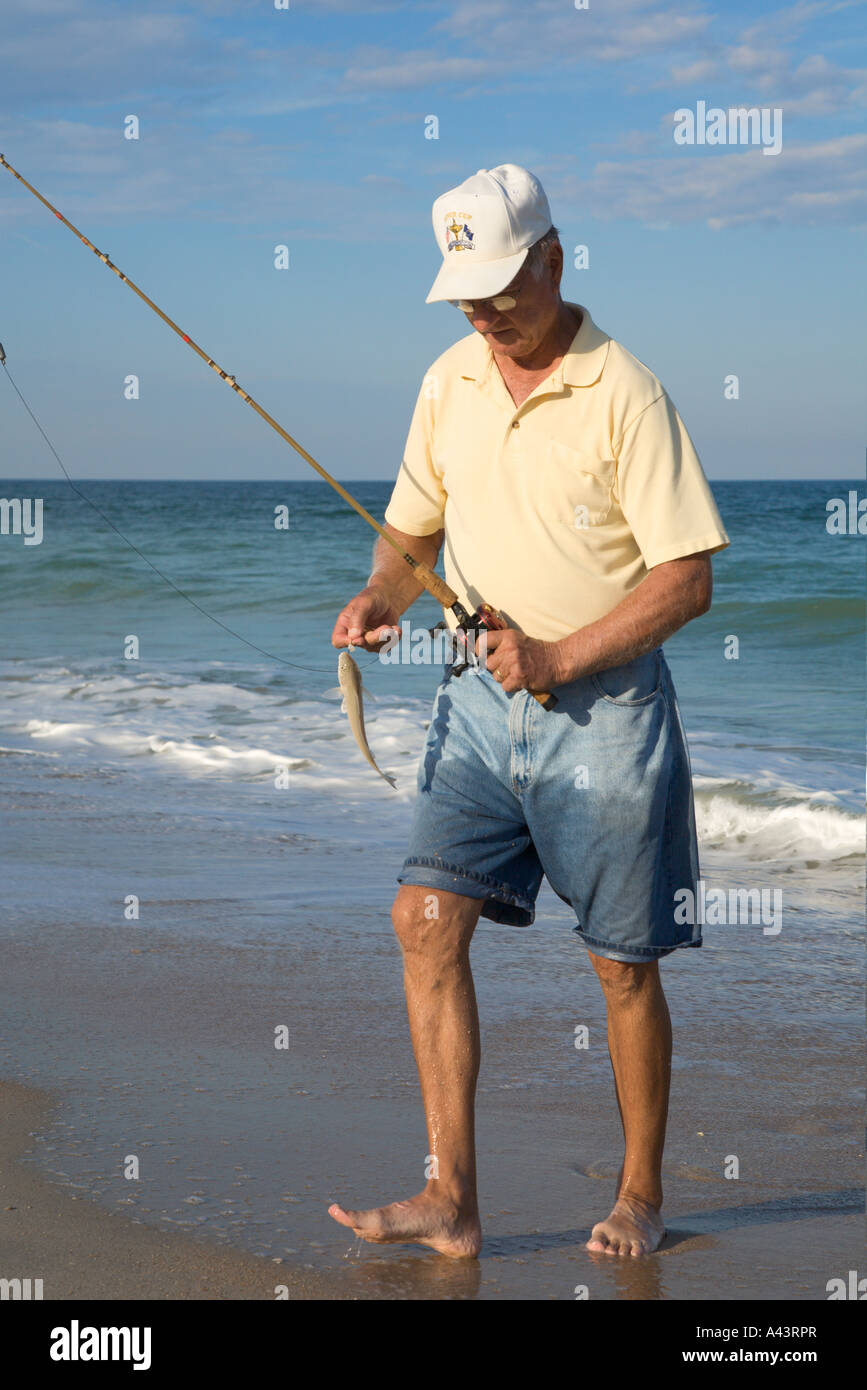 Man fishing for whiting on coast of Atlantic Ocean near St. Augustine ...