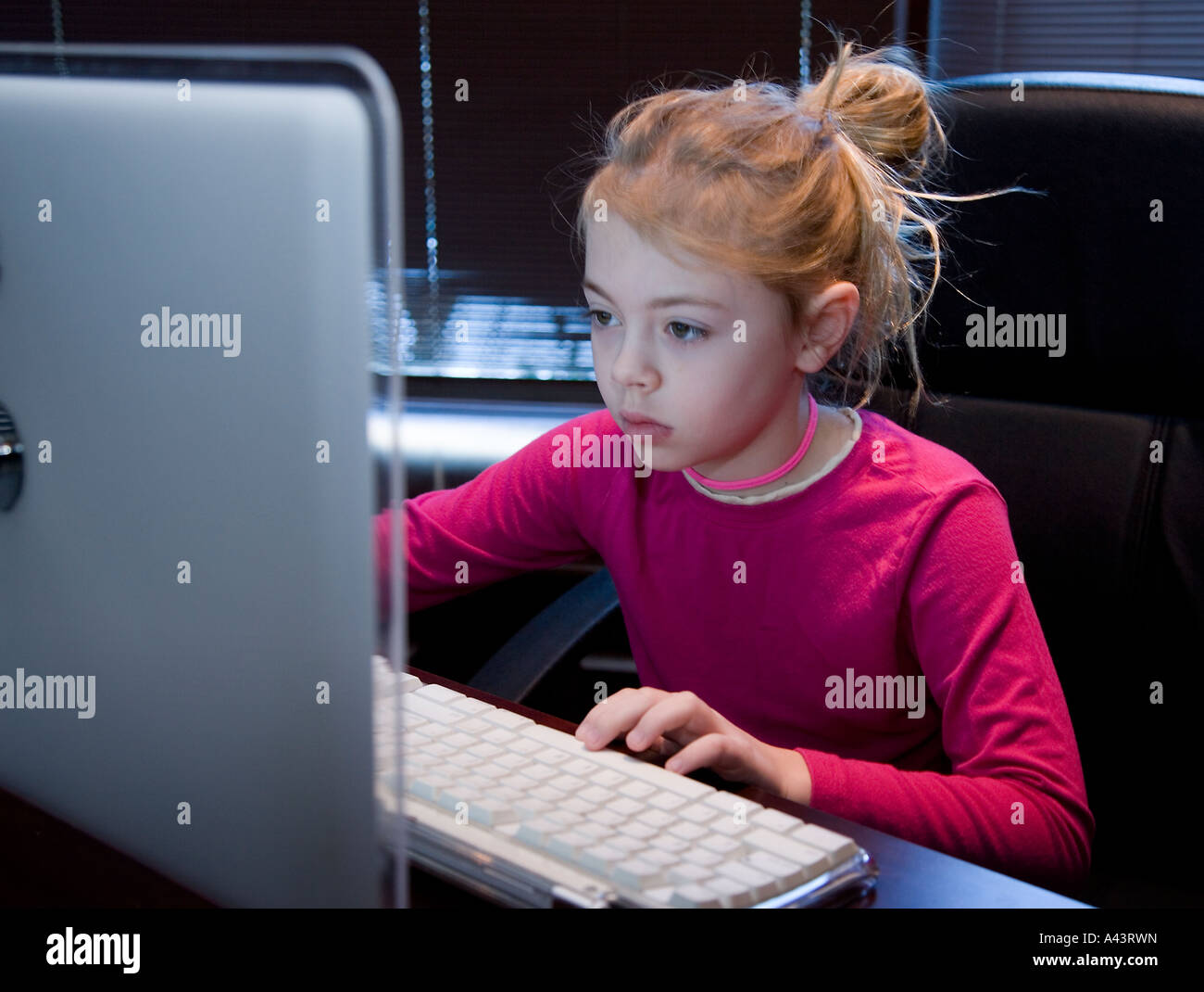 Child working with a computer Stock Photo - Alamy