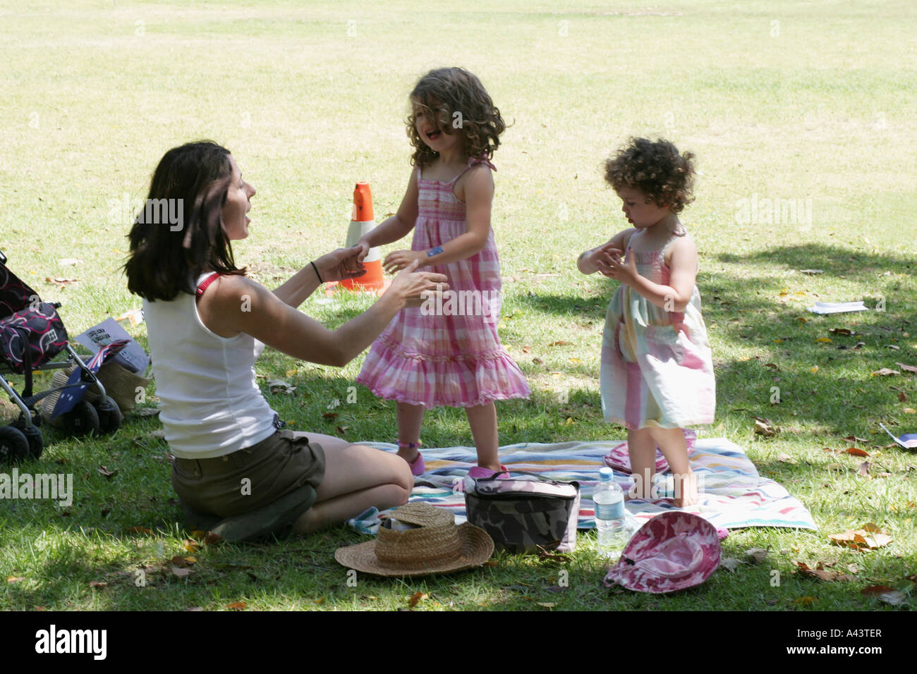 Mother and Children in Park Stock Photo - Alamy