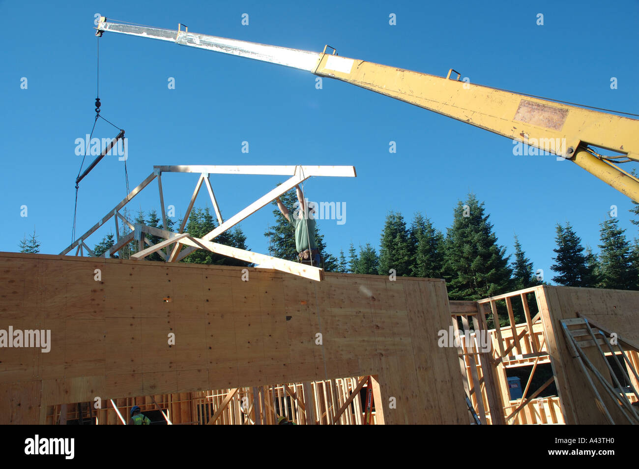 Crane lifting wood truss roof hi-res stock photography and images - Alamy