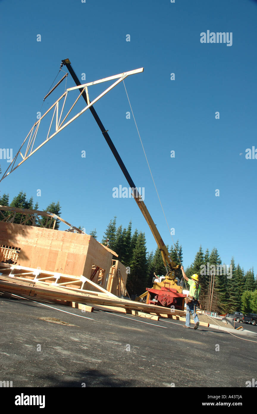Crane lifting wood truss roof hi-res stock photography and images - Alamy
