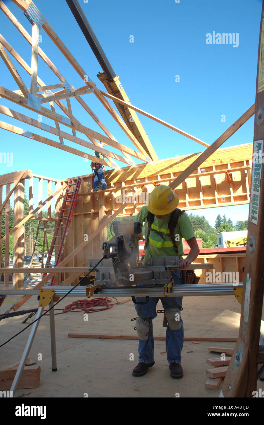 Construction - Workman Uses Saw To Cut Wood Stock Photo - Alamy