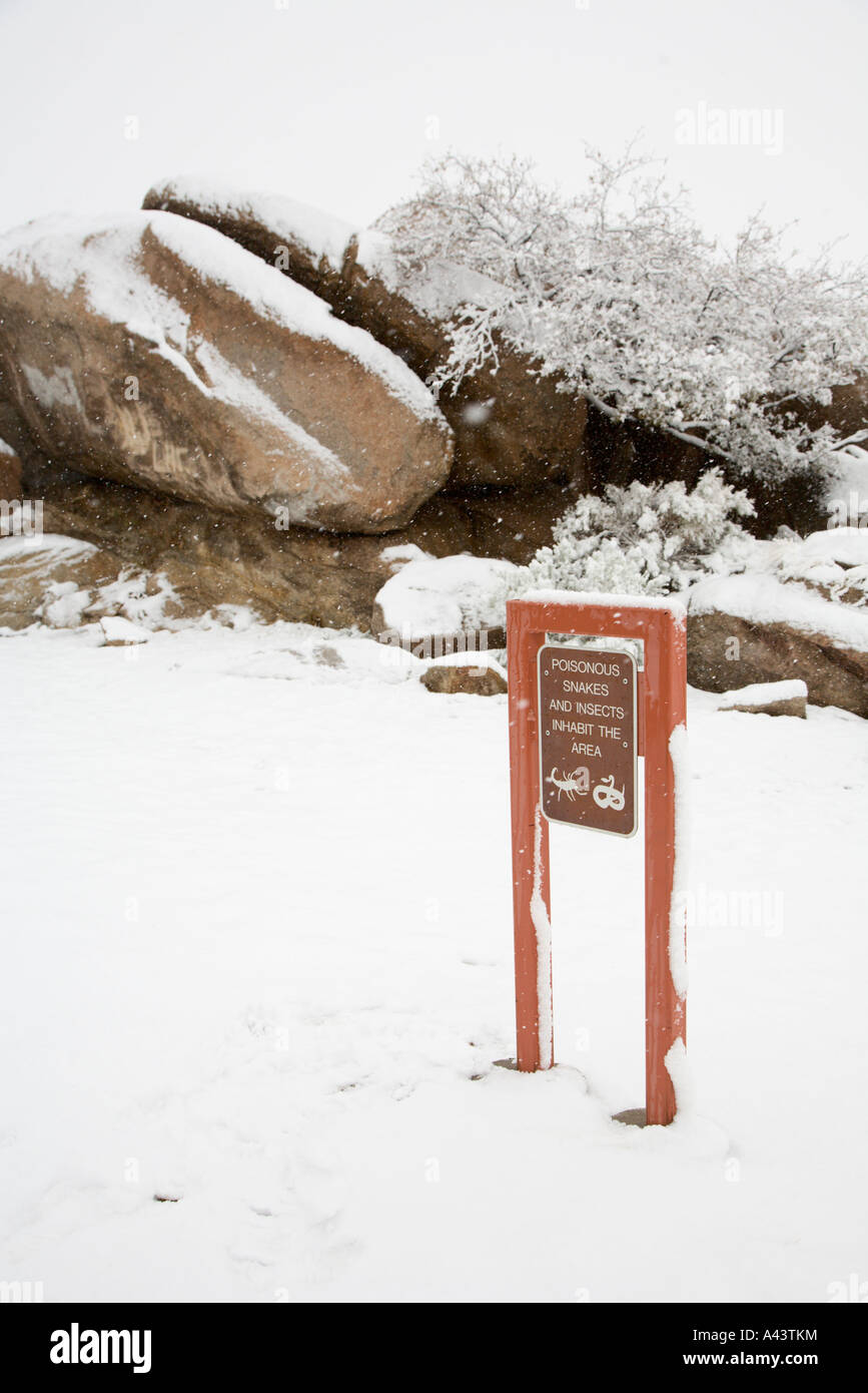 Snow covered sign warns of snakes and scorpions along interstate in ...