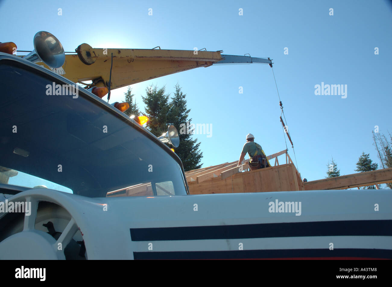 Construction - View Of Crane Truck Lifting Roof Truss Into Place With ...