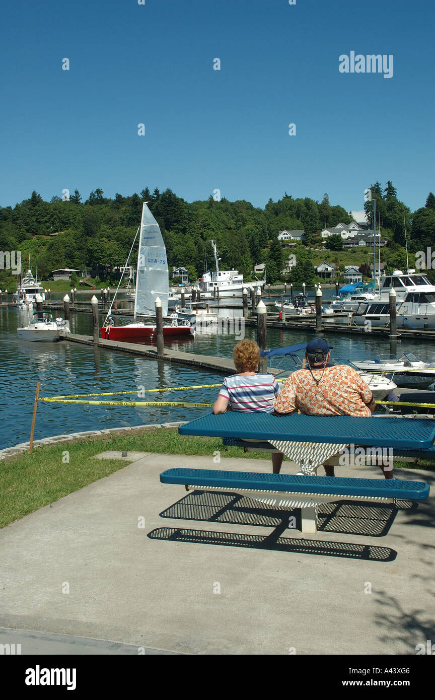 A Man and Woman Watching Activities At Marina Stock Photo - Alamy