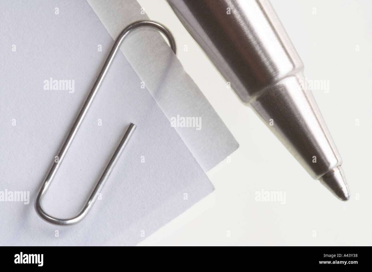 The office Pen paper and paperclip Stock Photo - Alamy