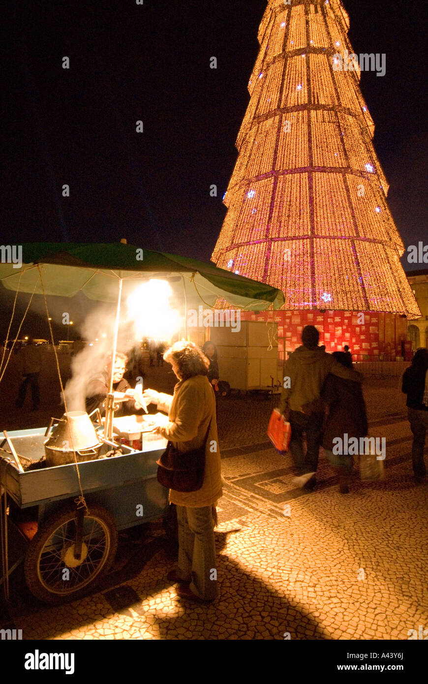 Street vendor selling chestnuts at christmas hi-res stock photography ...