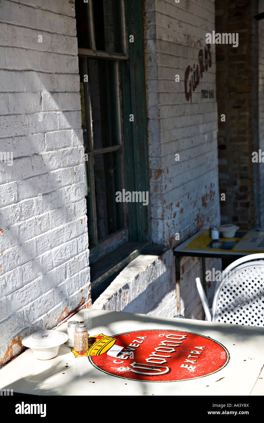TEXAS Austin Outdoor table against white brick wall at Gueros Taco Bar ...