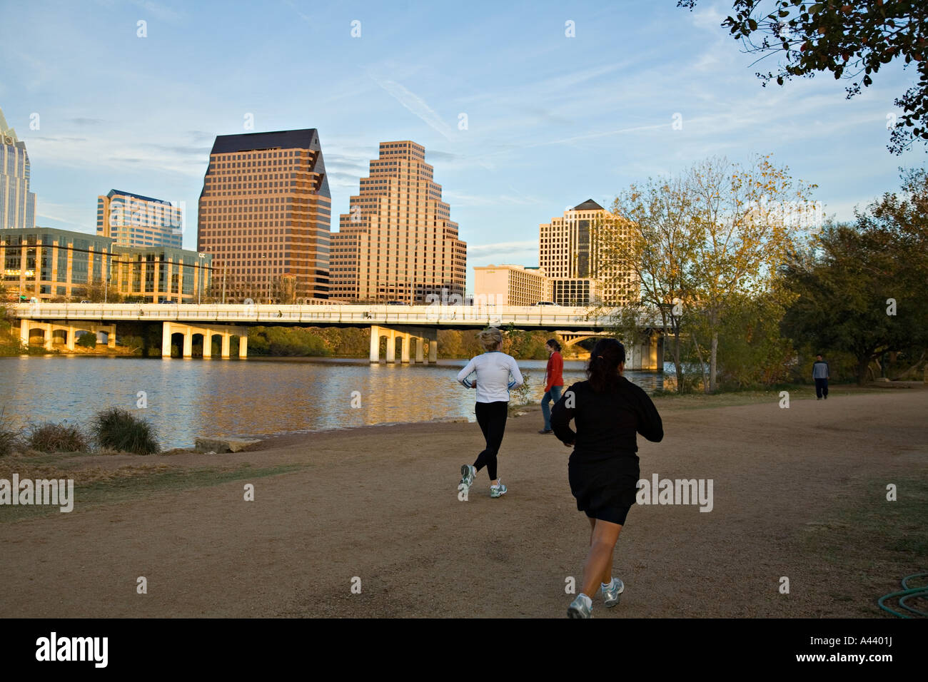 TEXAS Austin People run on exercise path in winter along Colorado River ...