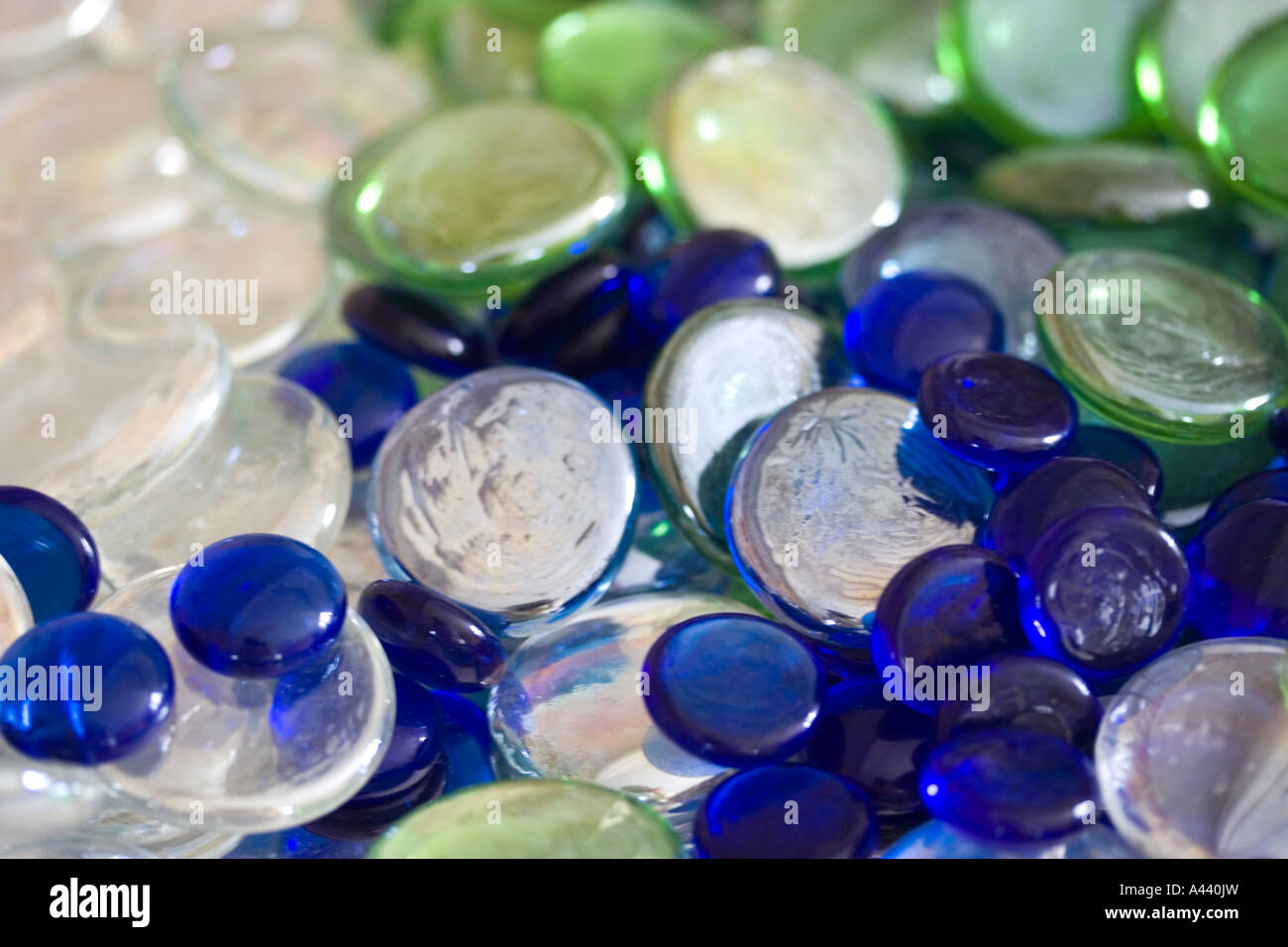 Glass discs in shades of blue and green, and clear Stock Photo - Alamy