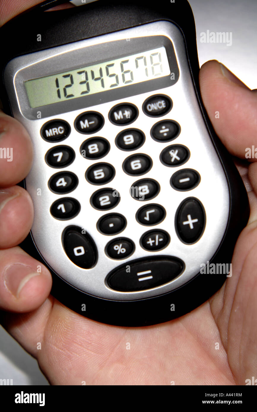 Calculator in hand Stock Photo - Alamy