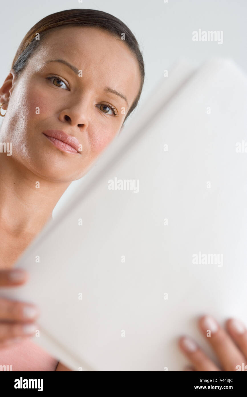 Woman portrait reading paperwork hi-res stock photography and images ...