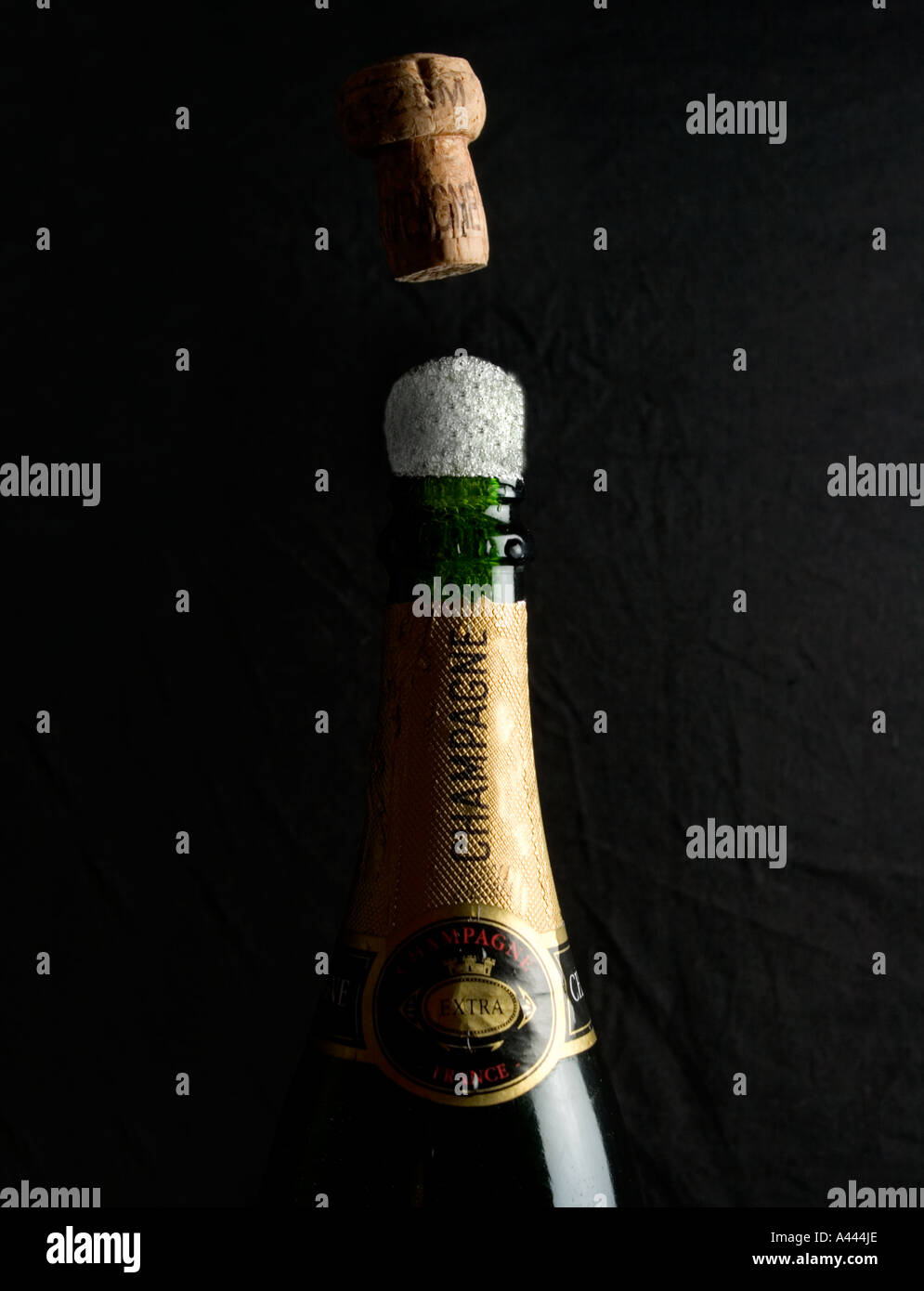 Champagne cork popping from a bottle of champagne Stock Photo - Alamy