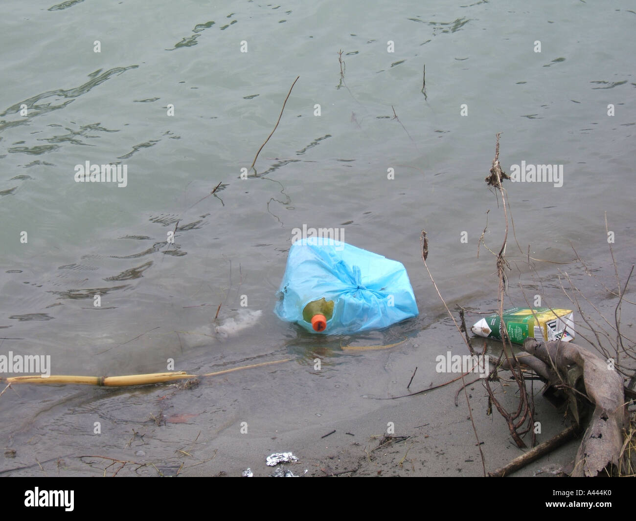 rubbish in river Stock Photo - Alamy