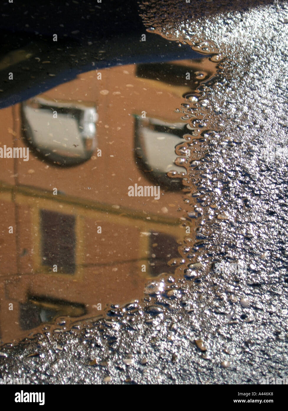 buildings reflected in puddle Stock Photo - Alamy