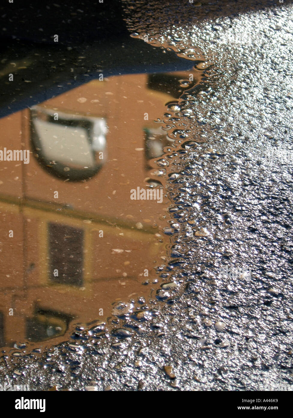 buildings reflected in puddle Stock Photo - Alamy