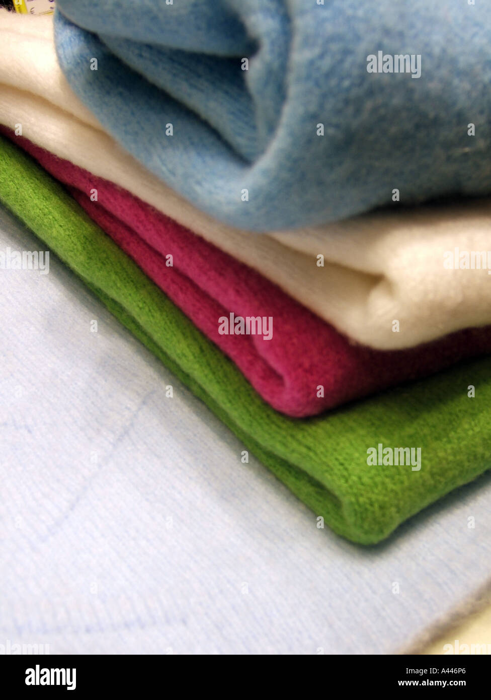 folded jumpers in shop window Stock Photo - Alamy