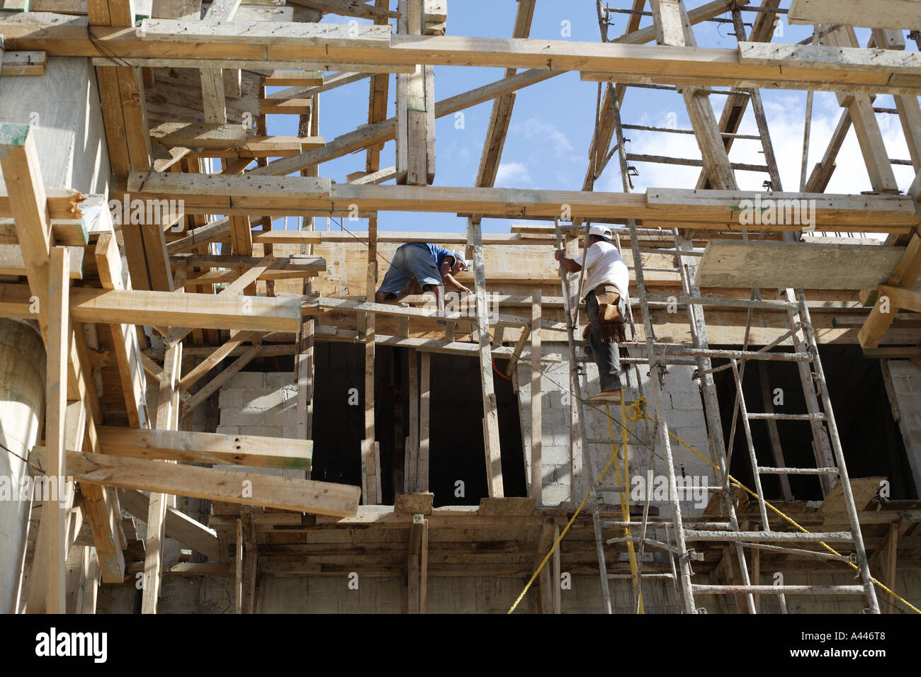 Mexican construction workers build a hotel in Playa Del Carmen Mexico ...