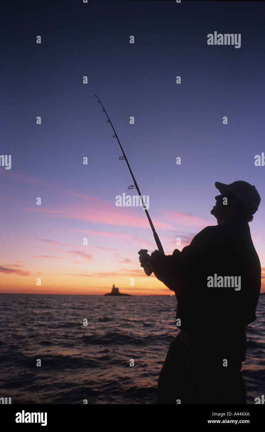 Fisherman reeling in fish hi-res stock photography and images - Alamy