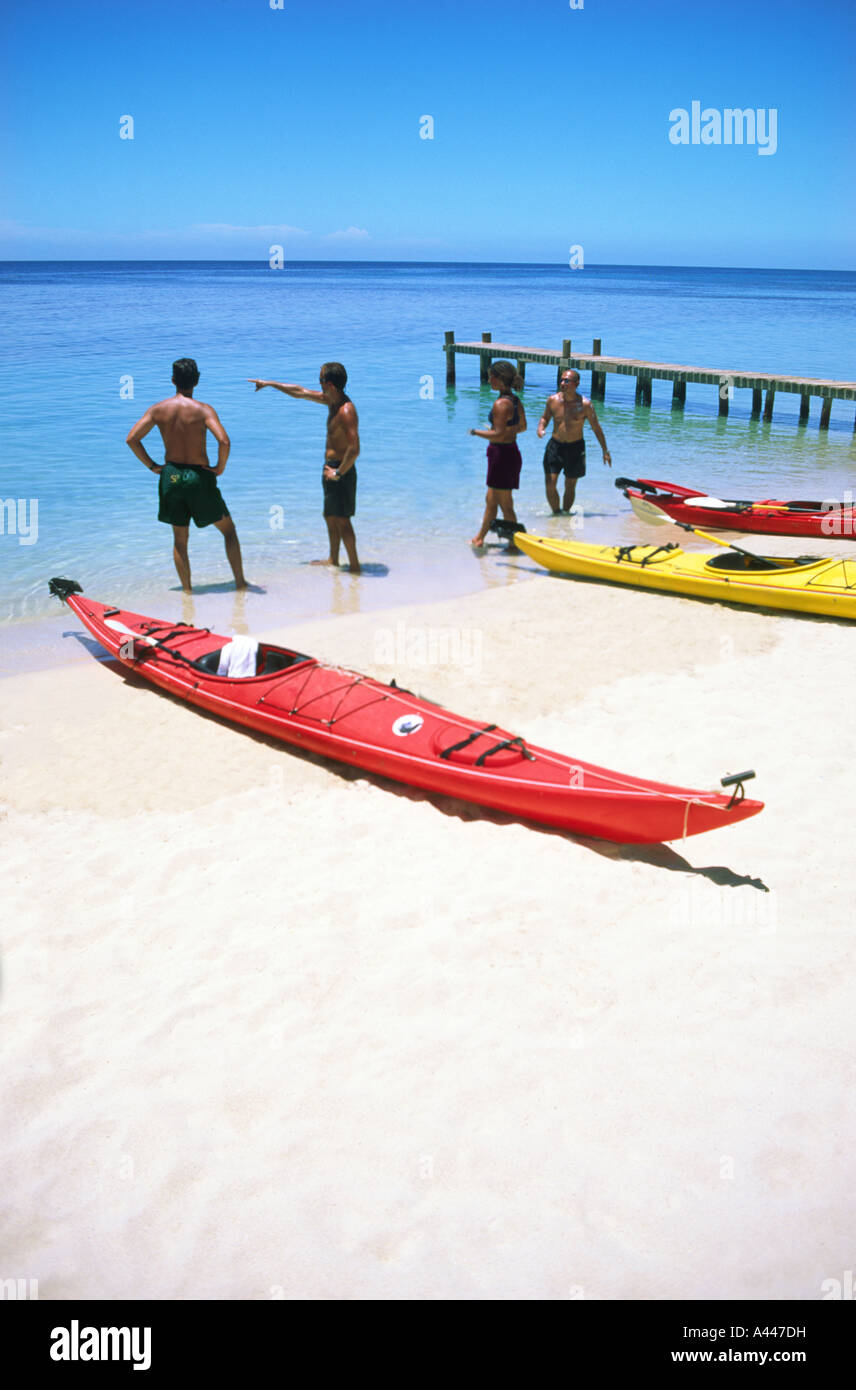 Kayakers on white sandy tropical beach Roatan Honduras Stock Photo - Alamy
