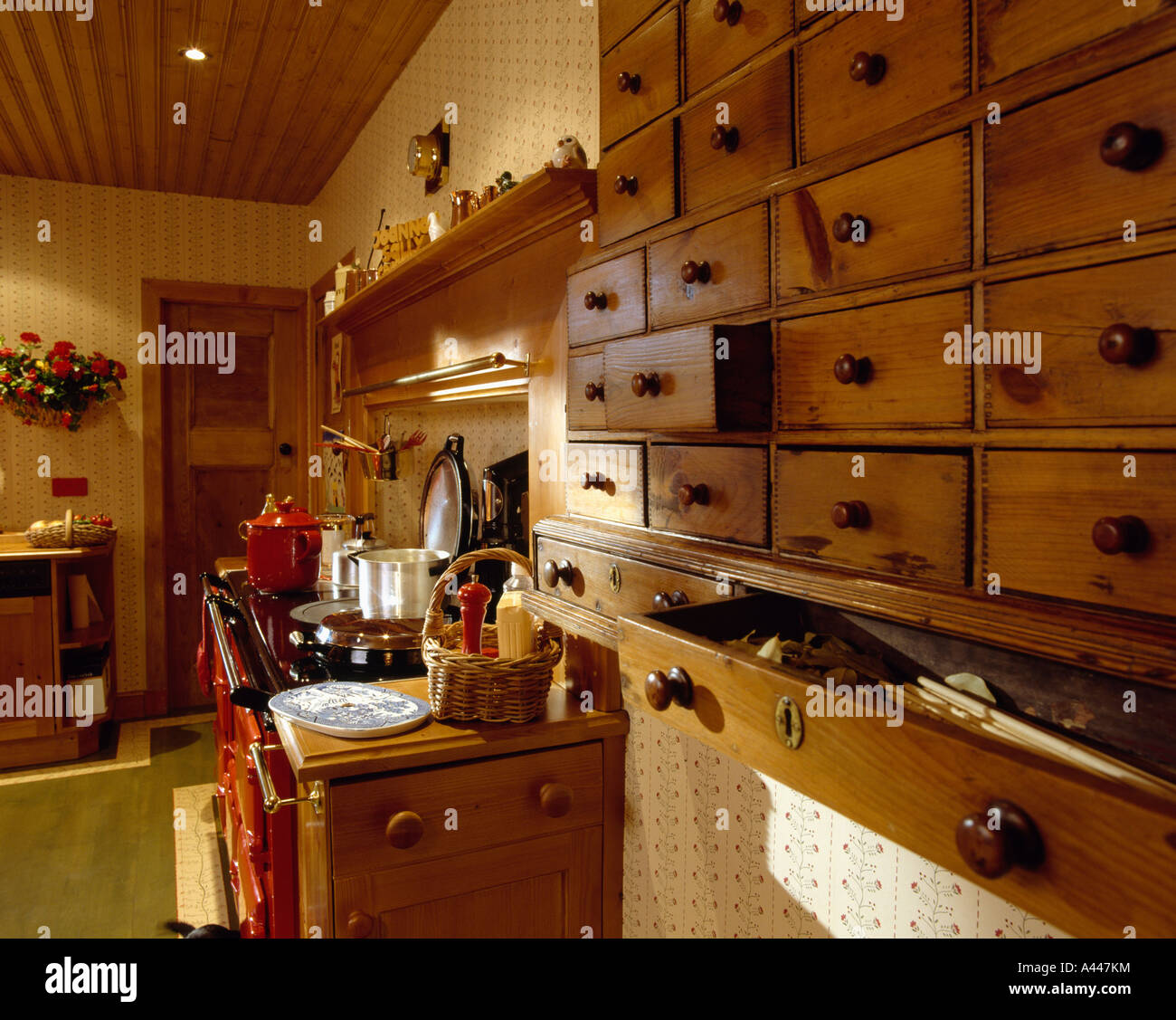 Wall-mounted antique wooden drawers in traditional kitchen Stock Photo ...