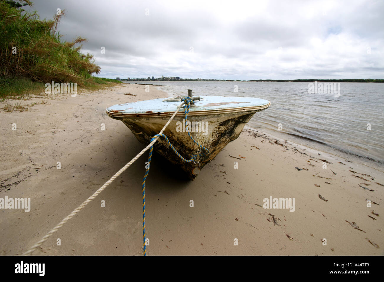 ROWBOAT TIED UP ON BEACH HORIZONTAL Stock Photo - Alamy