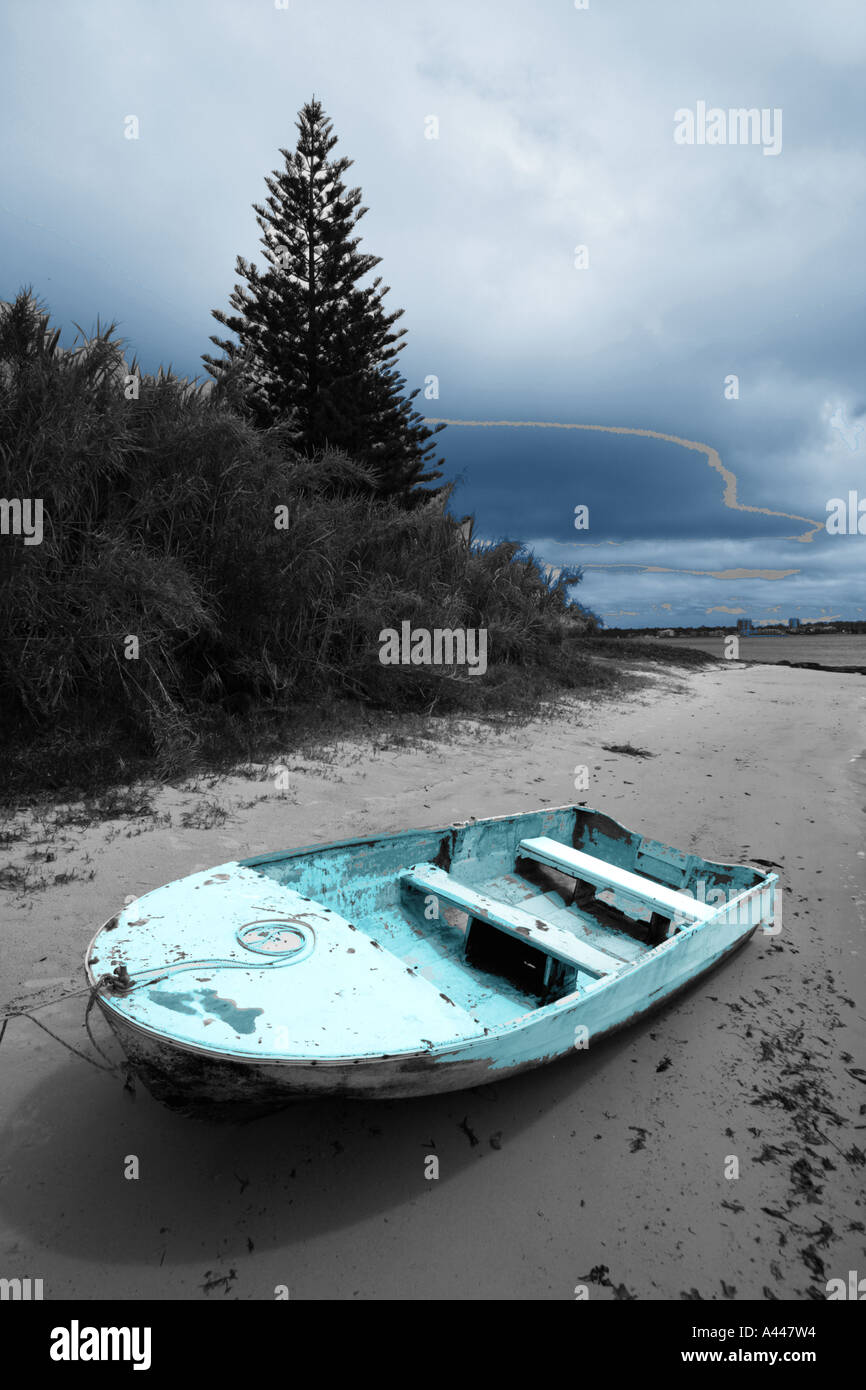 BLUE ROWBOAT TIED UP ON A BEACH VERTICAL Stock Photo - Alamy