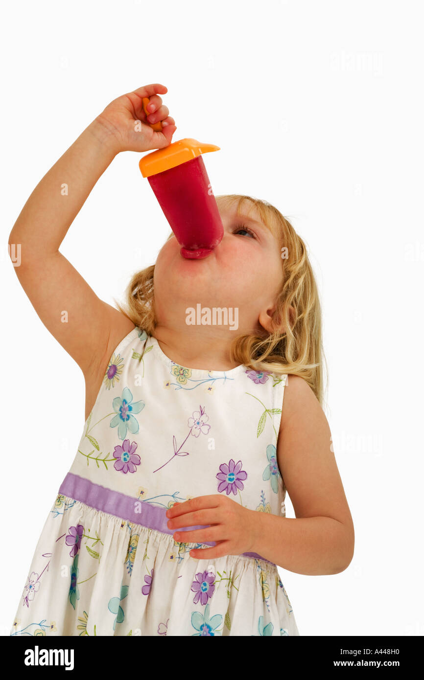 Child 3 Year old girl eating iced lolly Model Released Studio shot ...