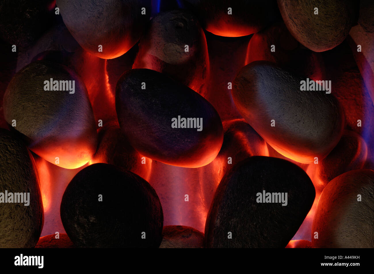 Pebble effect gas fire detail Stock Photo - Alamy