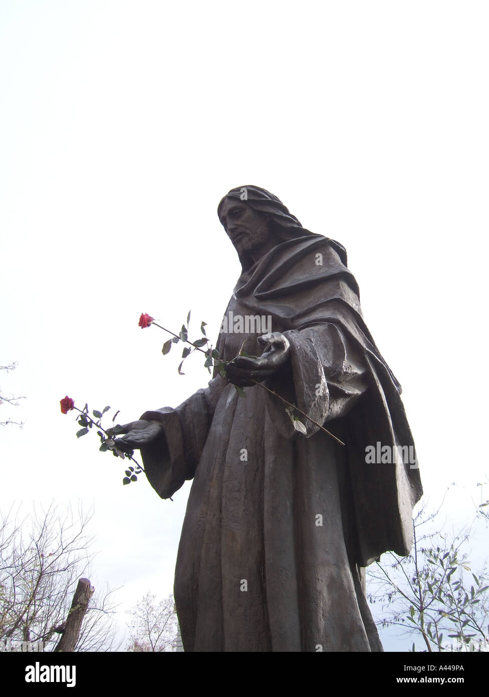 jesus statue hand holding wet rose in rain in rome Stock Photo - Alamy
