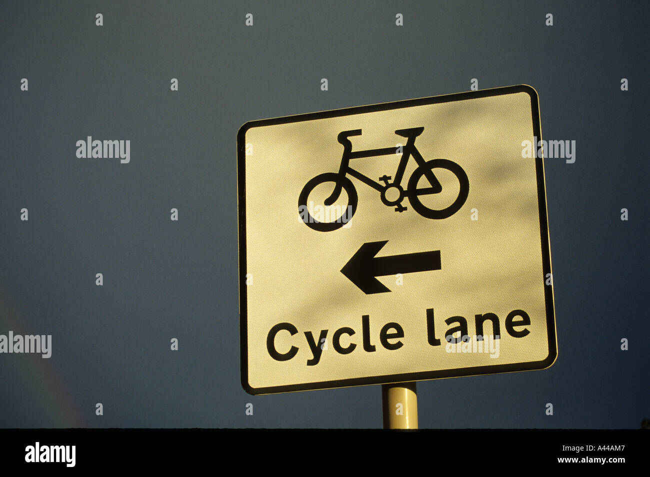 cycle lane sign against dark storm clouds Stock Photo - Alamy