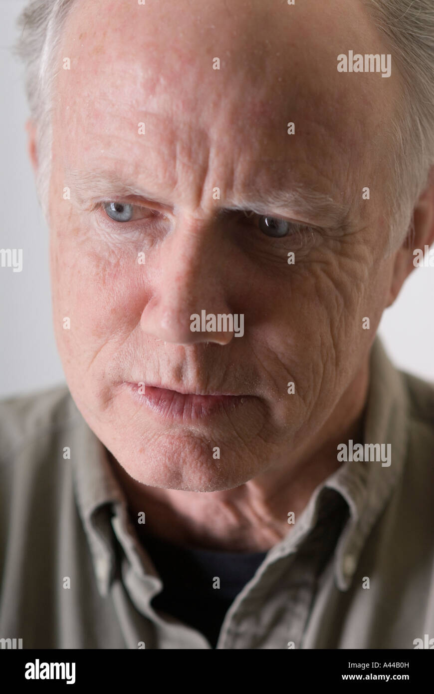 Portrait of a senior man with a concerned expression Stock Photo - Alamy