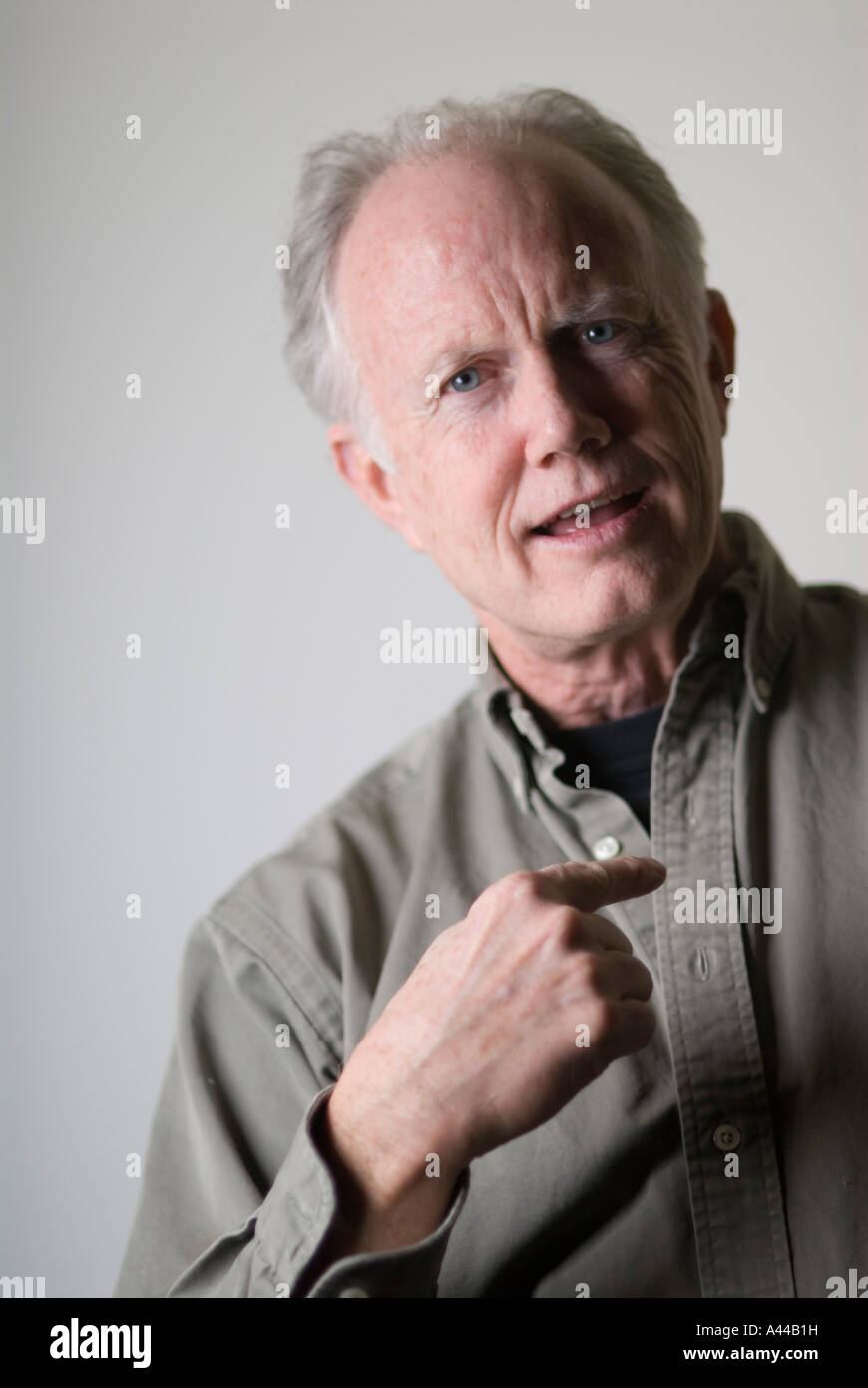 Old man pointing mouth hi-res stock photography and images - Alamy