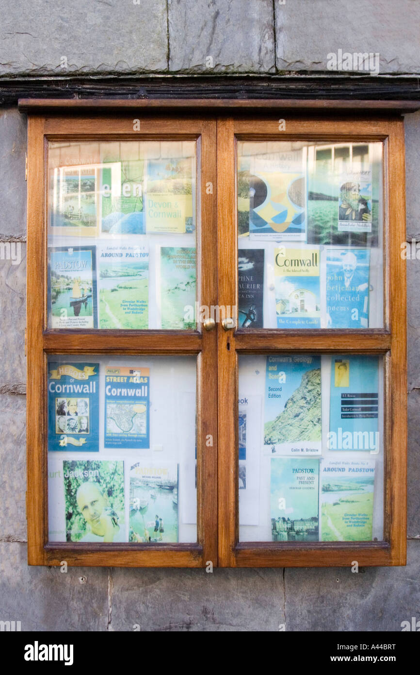 Faded information leaflets in advertising window. Padstow, North ...