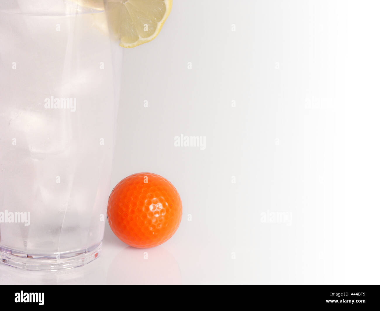 Refreshing drink with orange golf ball Stock Photo - Alamy